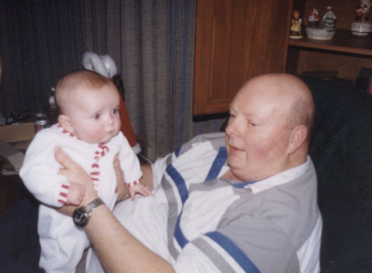 Phil Lester Holding A Baby